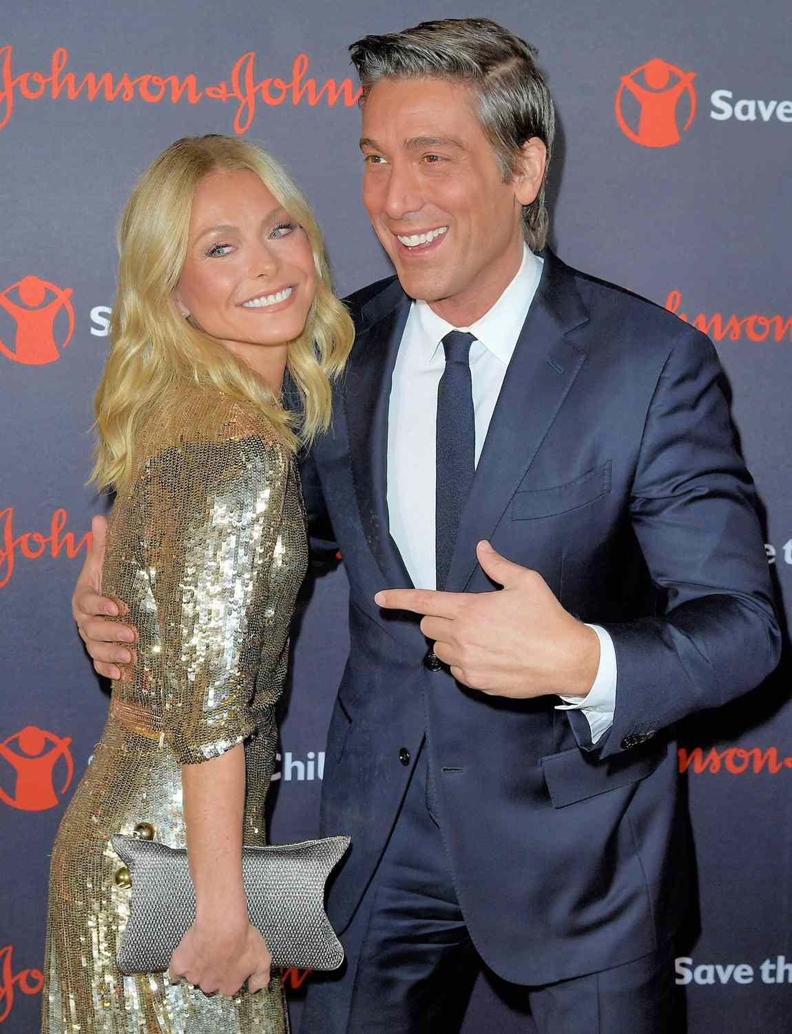 Kelly Ripa was caught striking a “suggestive” pose next to a portrait ...